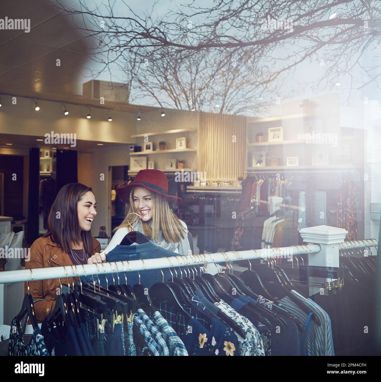 Grab that or Ill grab it for myself. two best friends out shopping in a ...