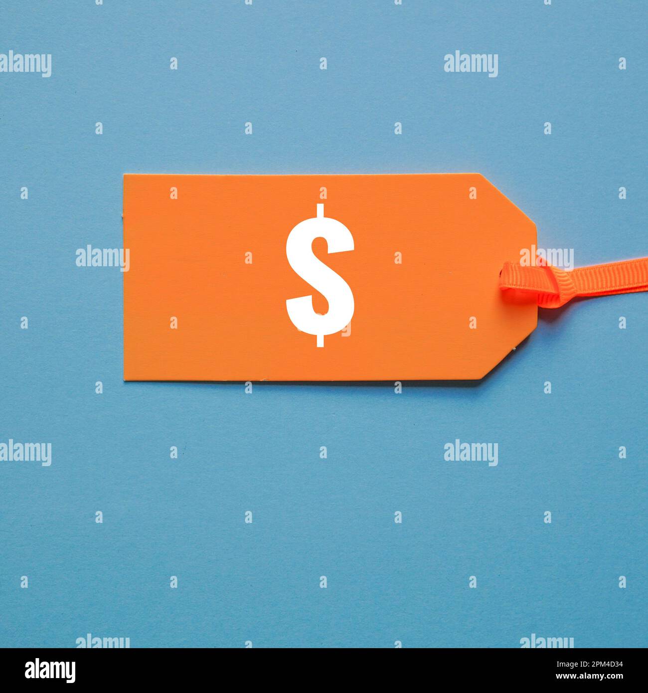 dollar symbol in orange price tag on blue background Stock Photo - Alamy