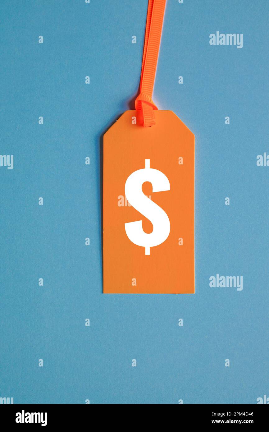 dollar symbol in orange price tag on blue background Stock Photo - Alamy