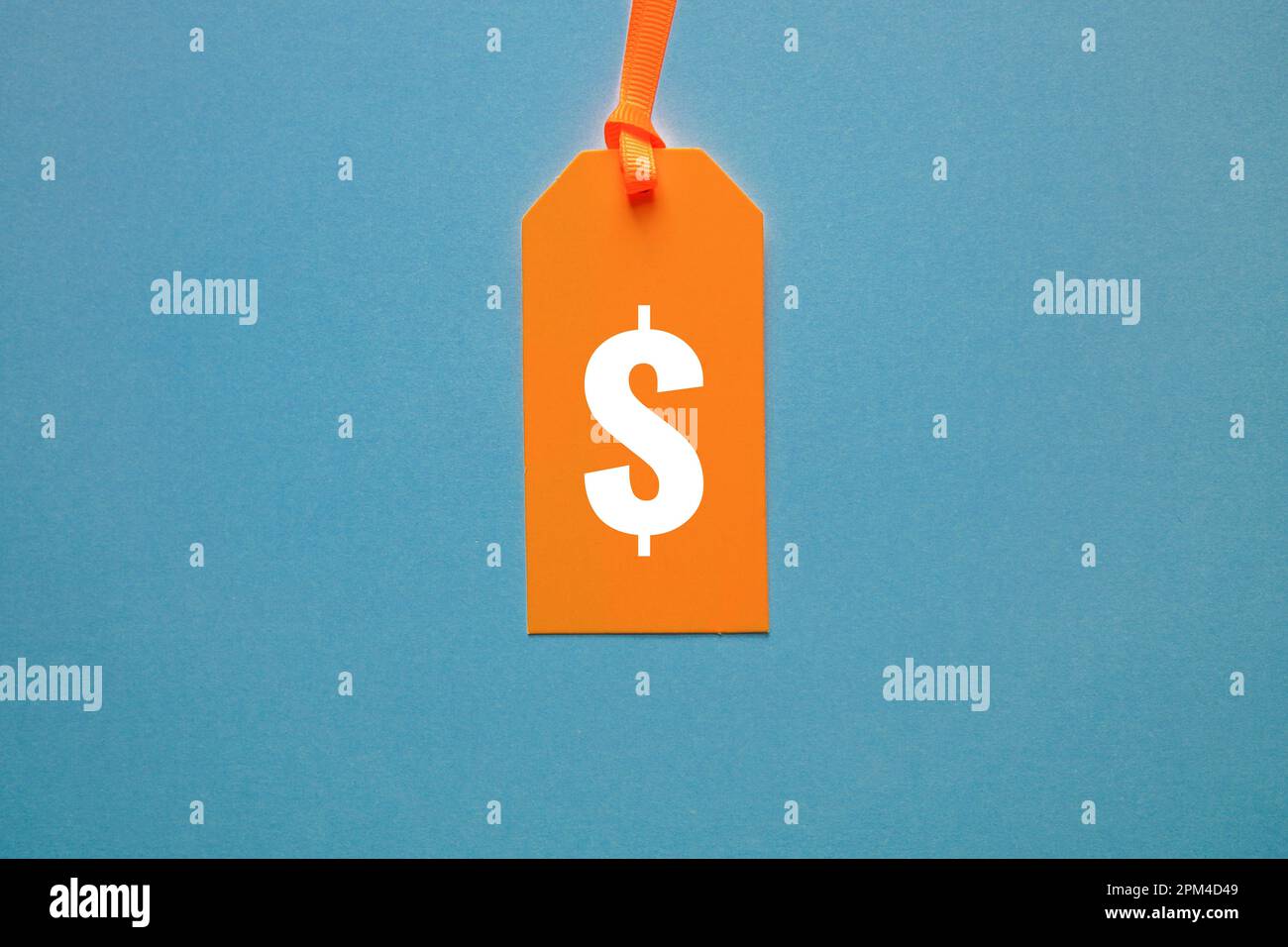 dollar symbol in orange price tag on blue background Stock Photo - Alamy