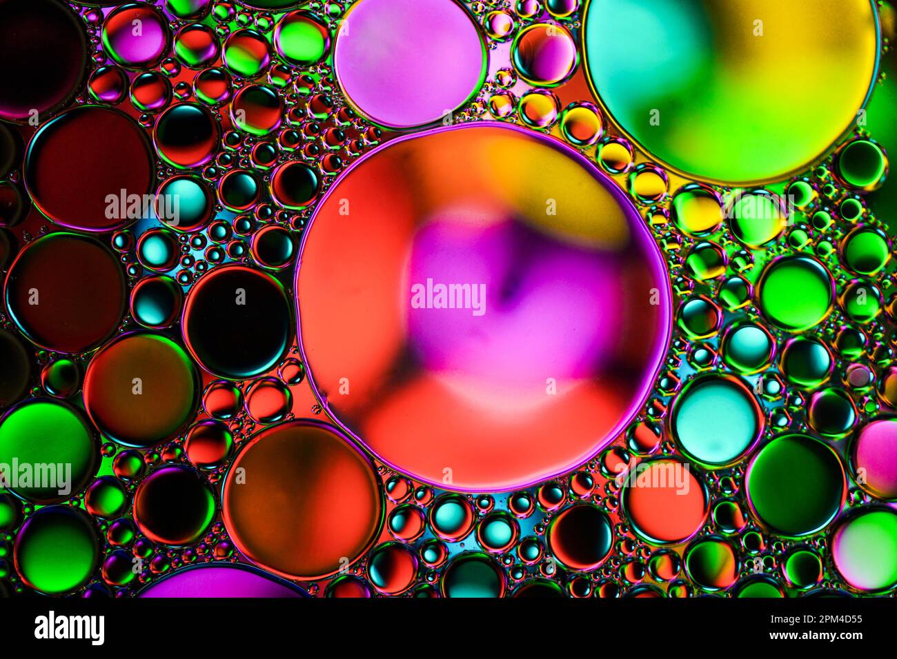 multi colored oil circles on the water, colorful background Stock Photo ...