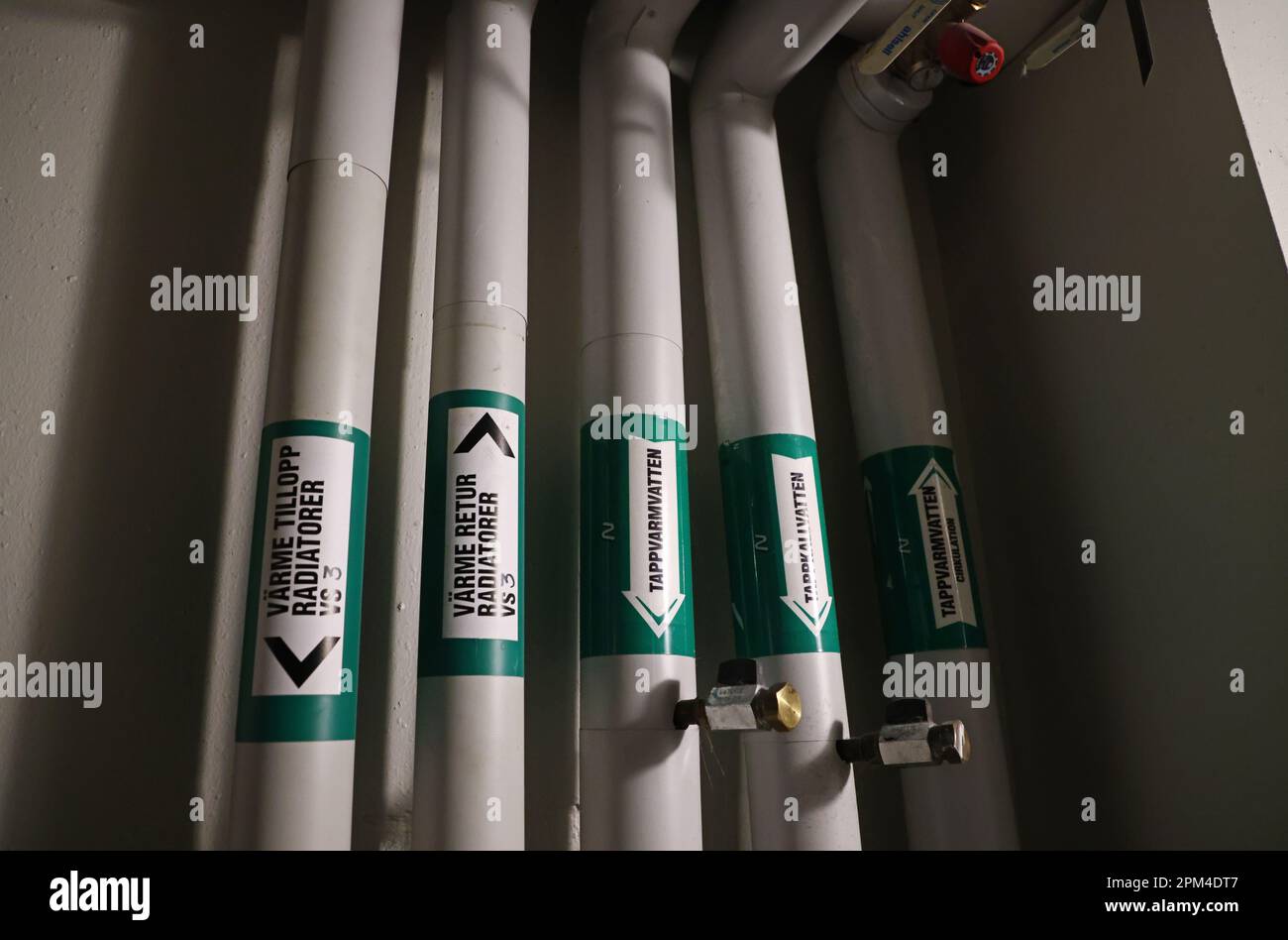 Heating and water pipes in an apartment building Stock Photo - Alamy
