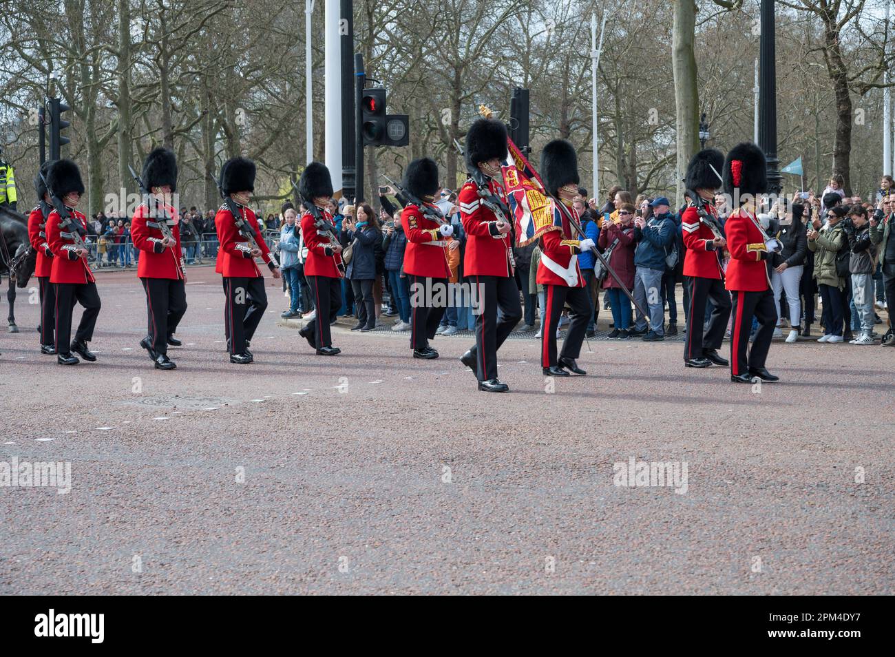 Guardsmen in ceremonial uniform with bearskins marching with shouldered ...