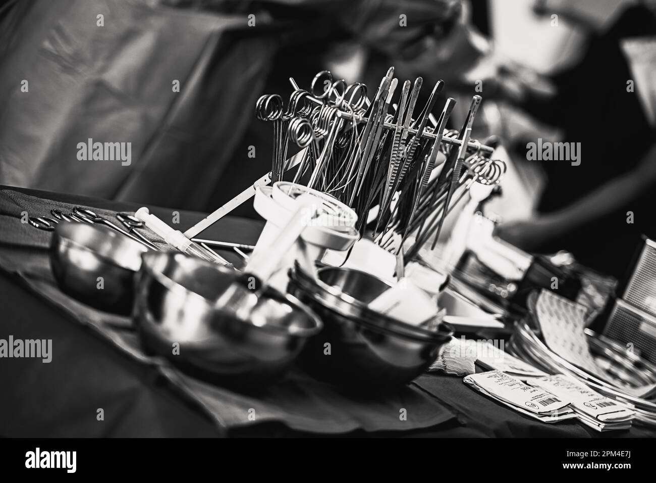 An overhead closeup shot of medical surgery instruments on a sterile ...