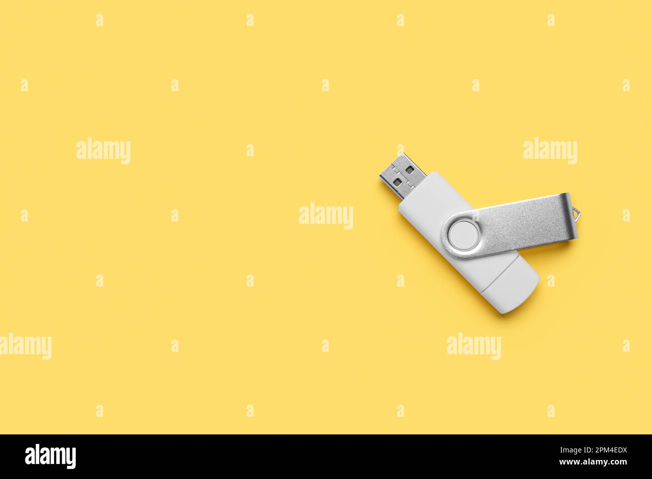 Open USB flash drive on yellow background Stock Photo - Alamy