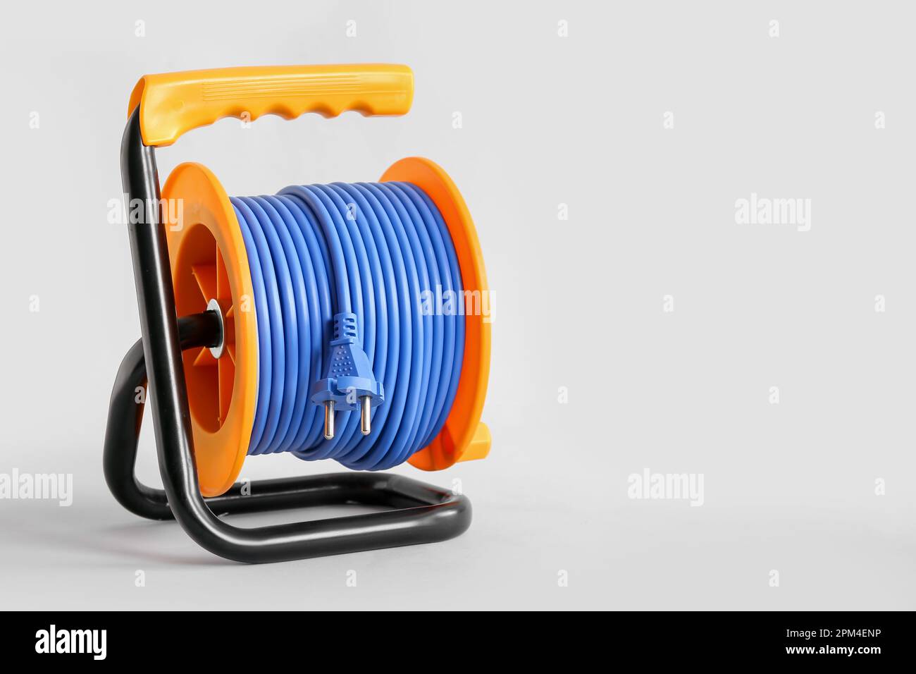 Blue extension electric cable reel on white background Stock Photo - Alamy