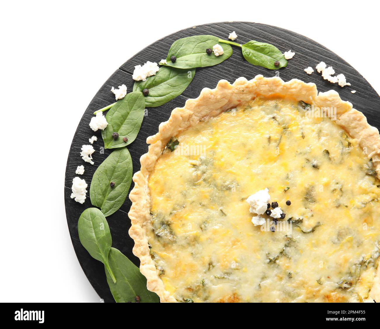 Board with delicious quiche, spinach leaves and cottage cheese isolated ...