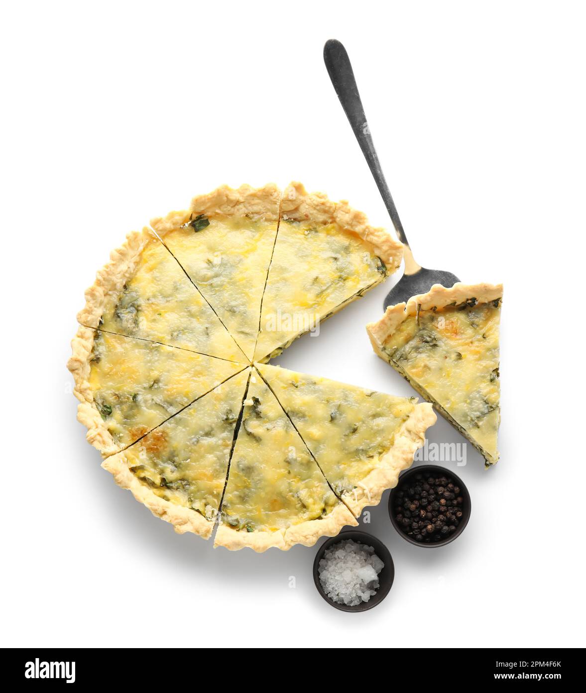 Pieces of delicious quiche, spatula and seasoning isolated on white ...