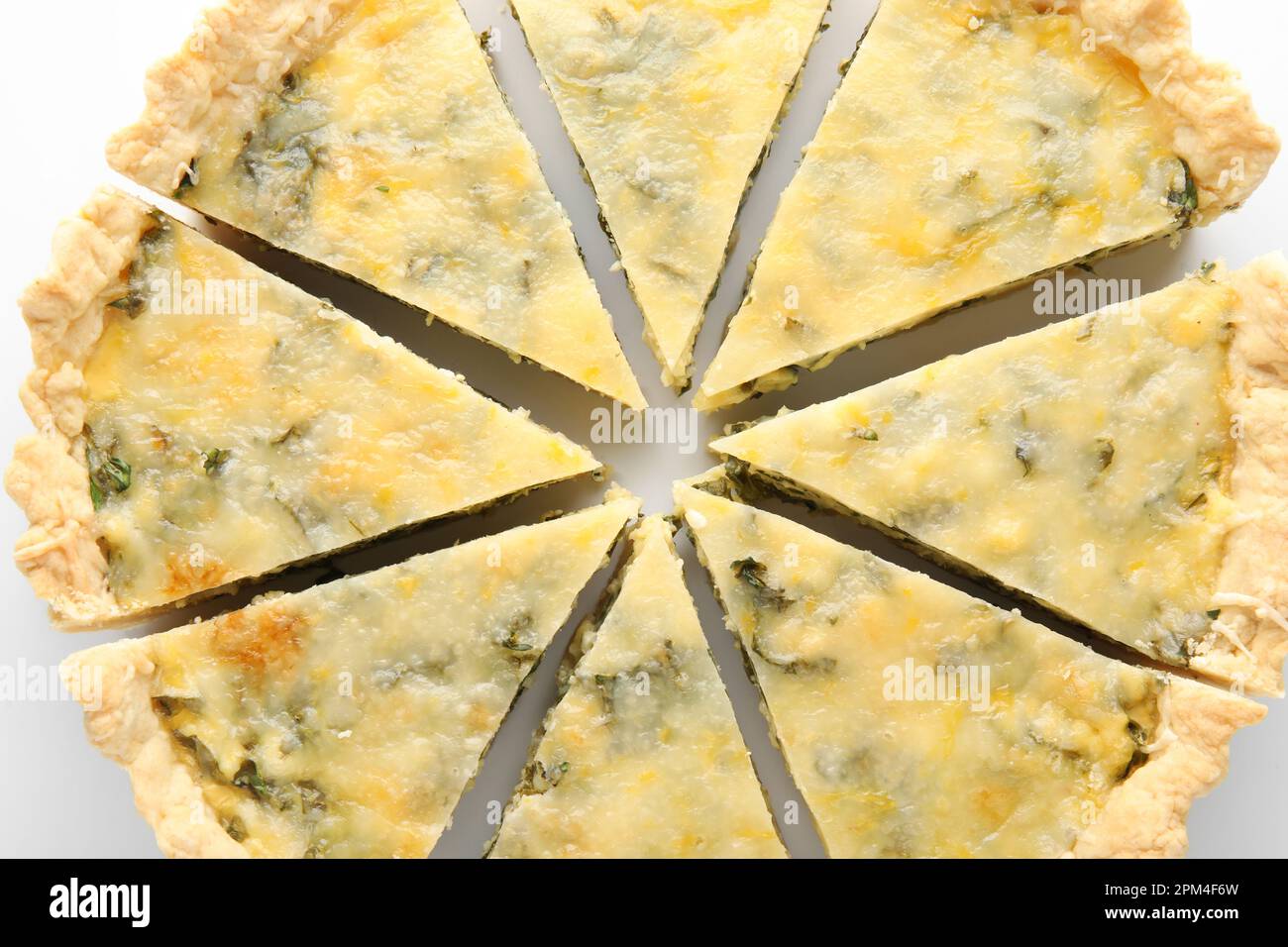 Pieces of delicious quiche isolated on white background Stock Photo - Alamy