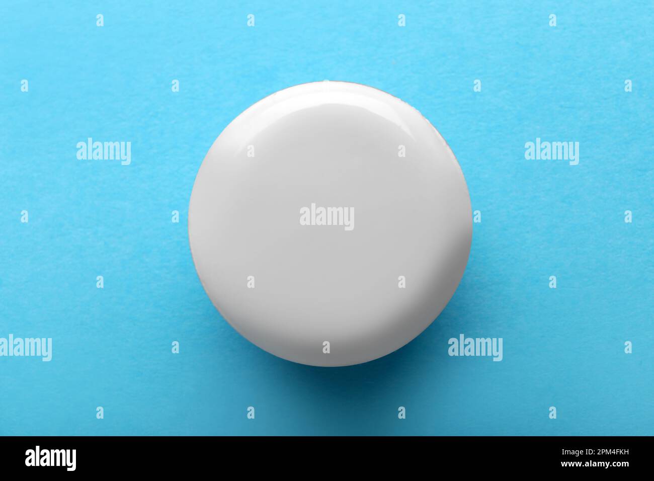 Blank white badge on blue background Stock Photo - Alamy