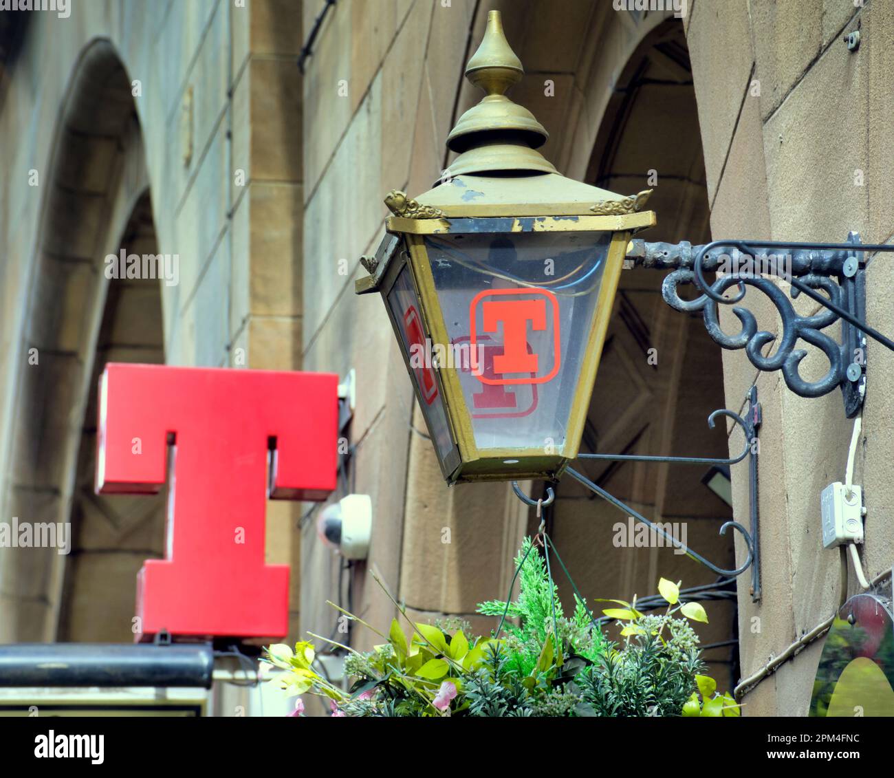 old pub wall alcohol sign tennents red lager Glasgow, Scotland, UK ...