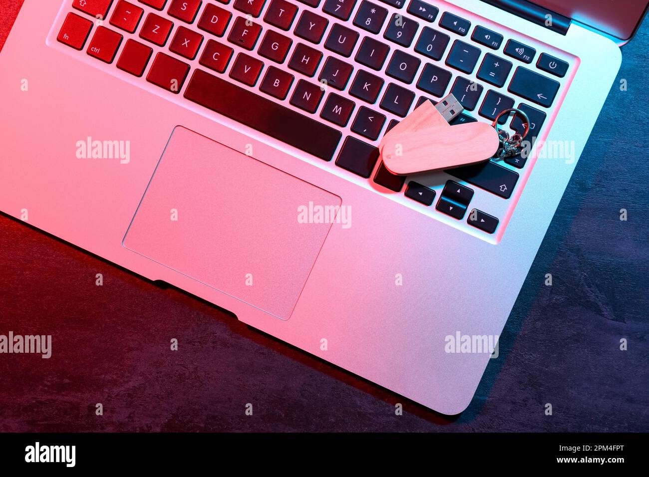 Modern laptop and wooden USB flash drive on black table Stock Photo - Alamy