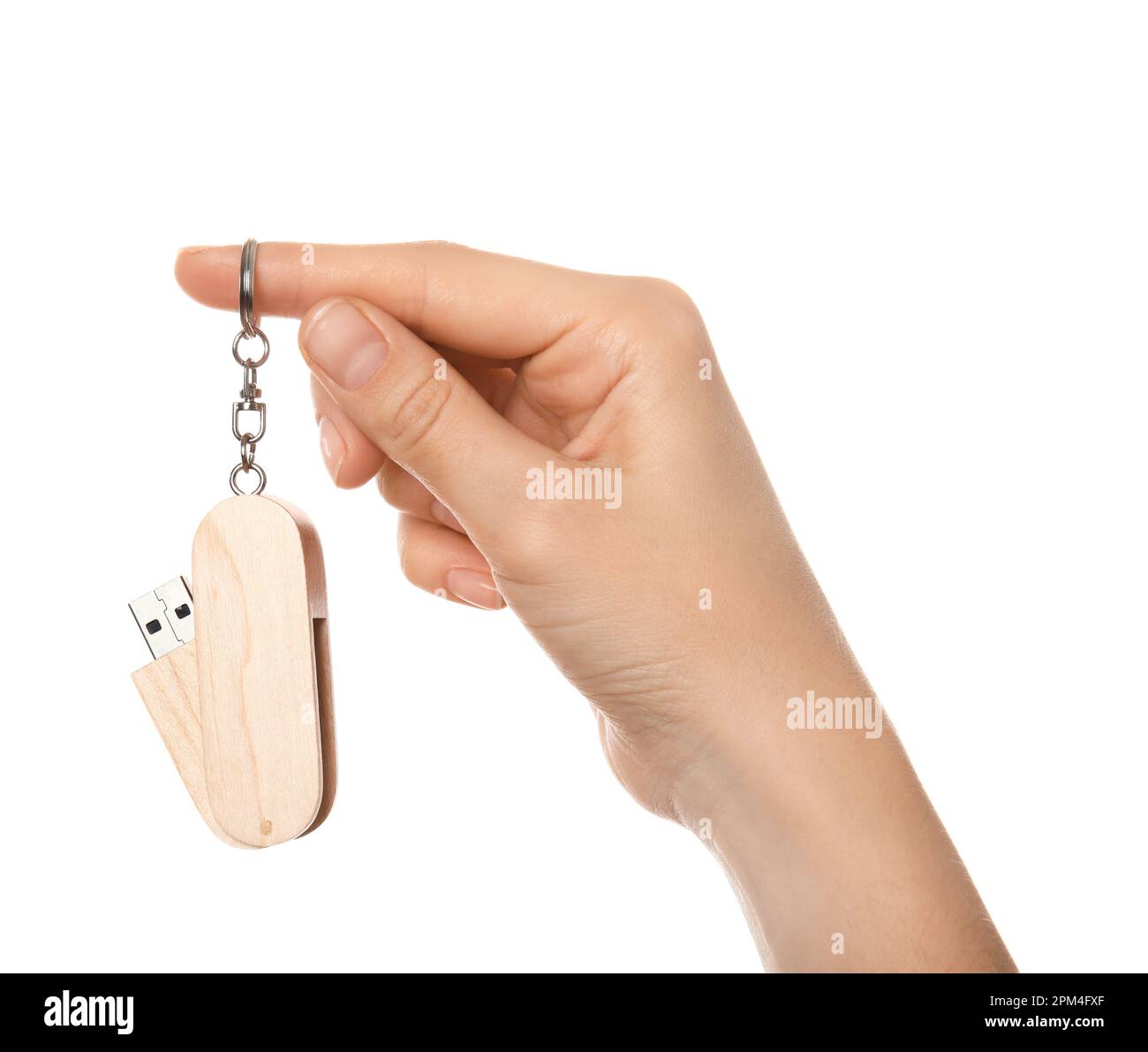 Woman holding wooden USB flash drive isolated on white background Stock ...