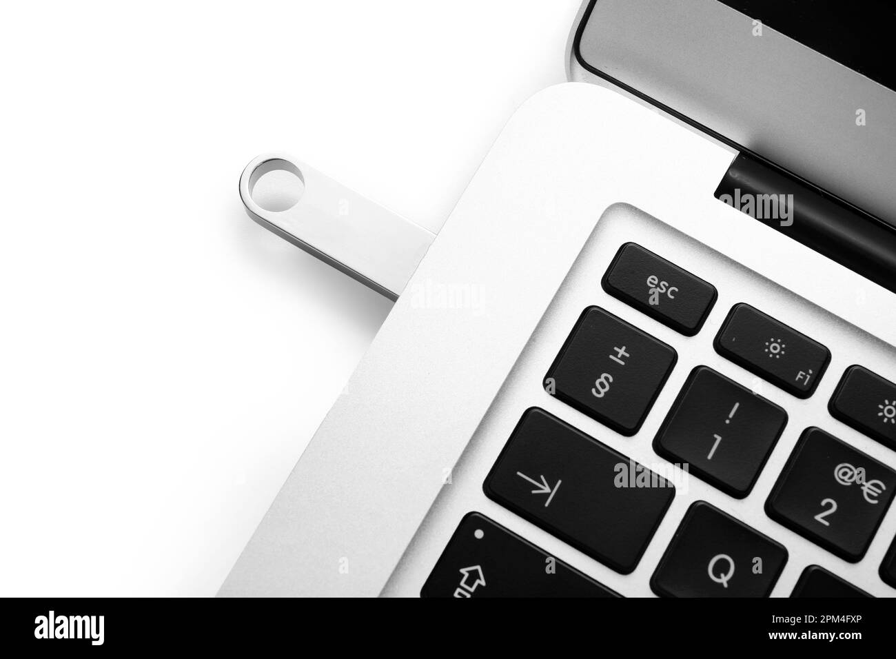 Modern laptop with metallic USB flash drive isolated on white ...