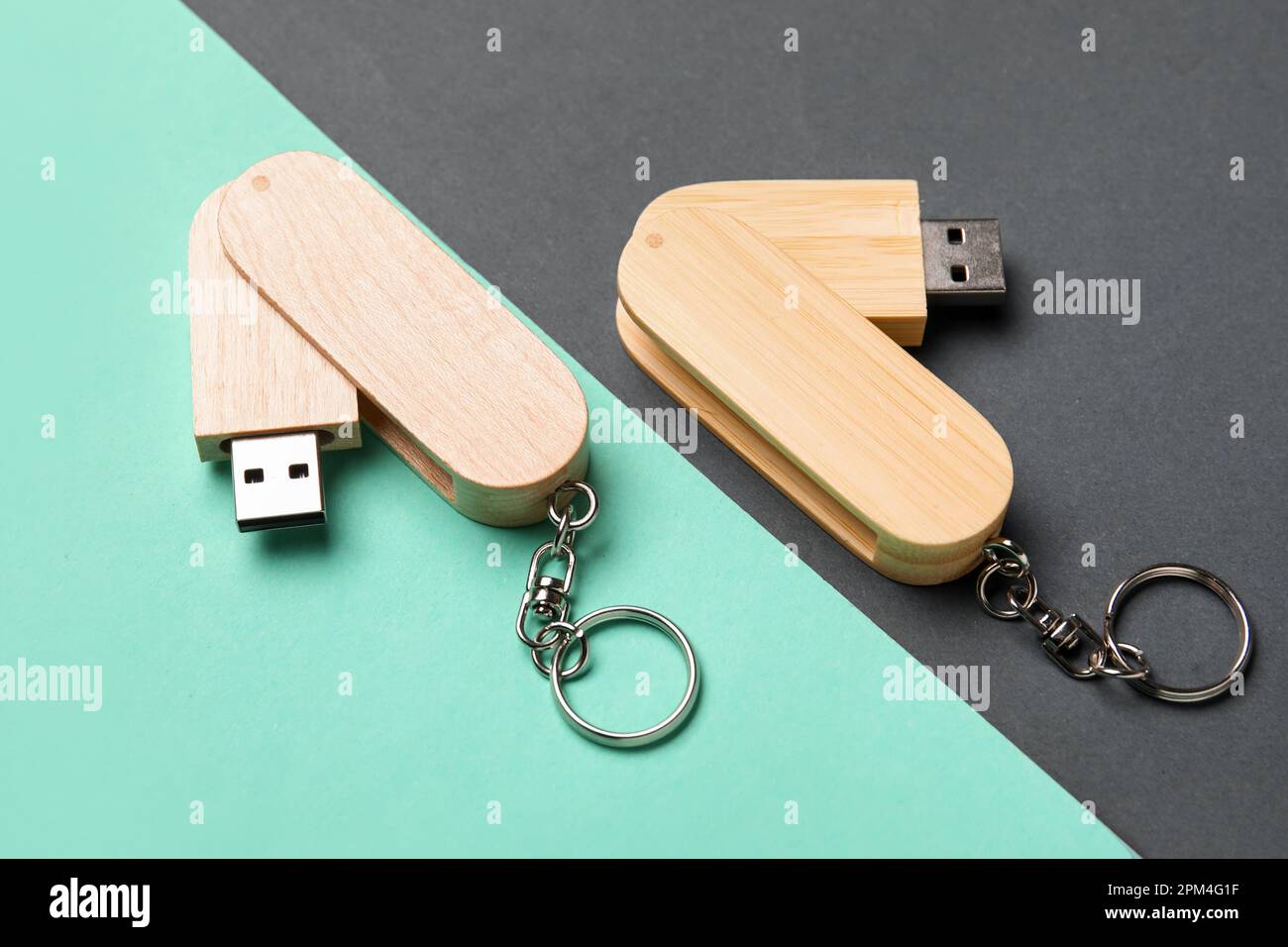 Wooden USB flash drives on turquoise and black background Stock Photo ...