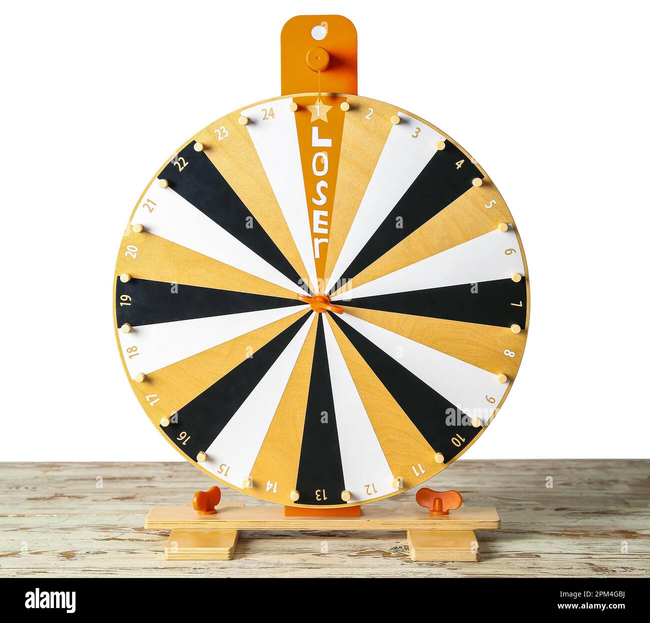 Spinning wheel with word LOSER on table against white background Stock ...