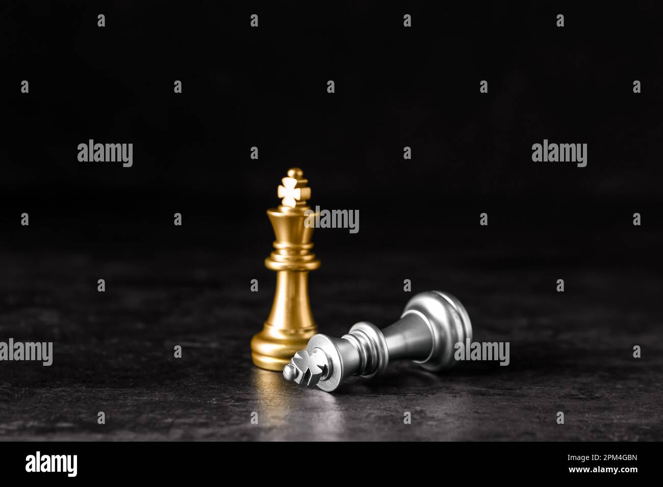 Chess pieces on dark background. Loser concept Stock Photo - Alamy