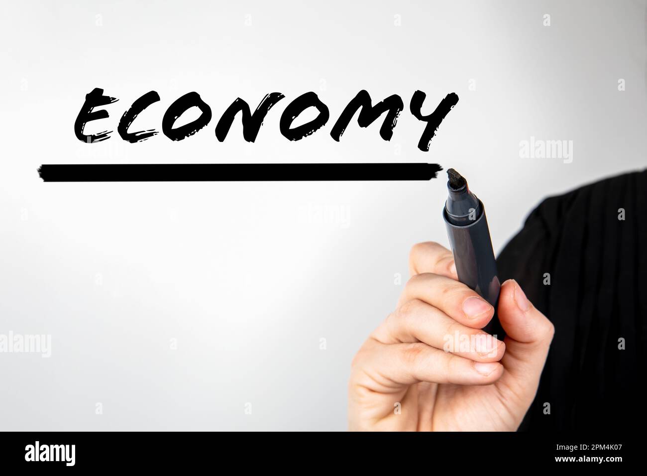 Economy Concept. Hand writing text with marker on a white background ...