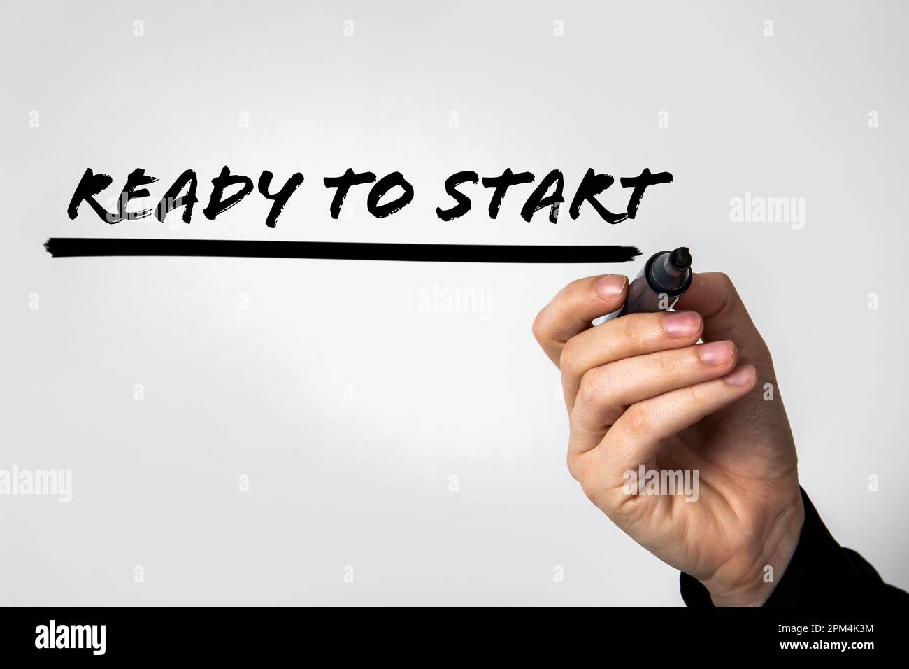 Ready to start. Text, black marker in a woman's hand on a white ...