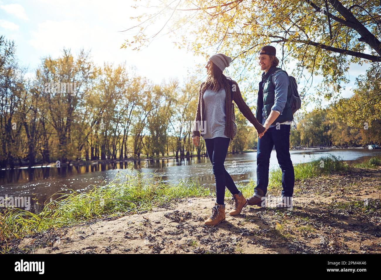 Leading him on a nature walk. Full length shot of an affectionate young ...