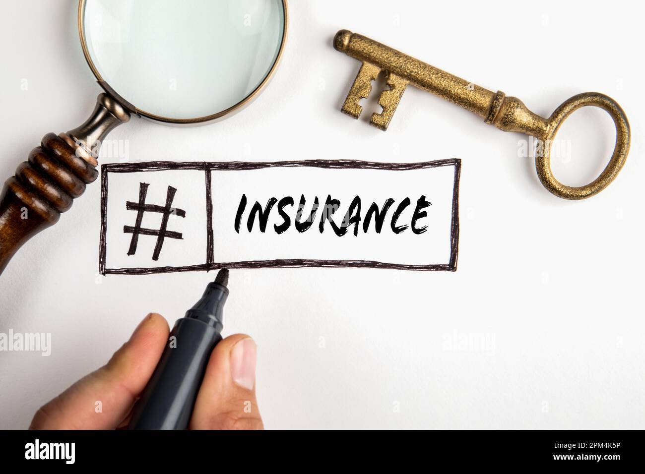 Insurance Concept. Golden key and magnifying glass on a white ...