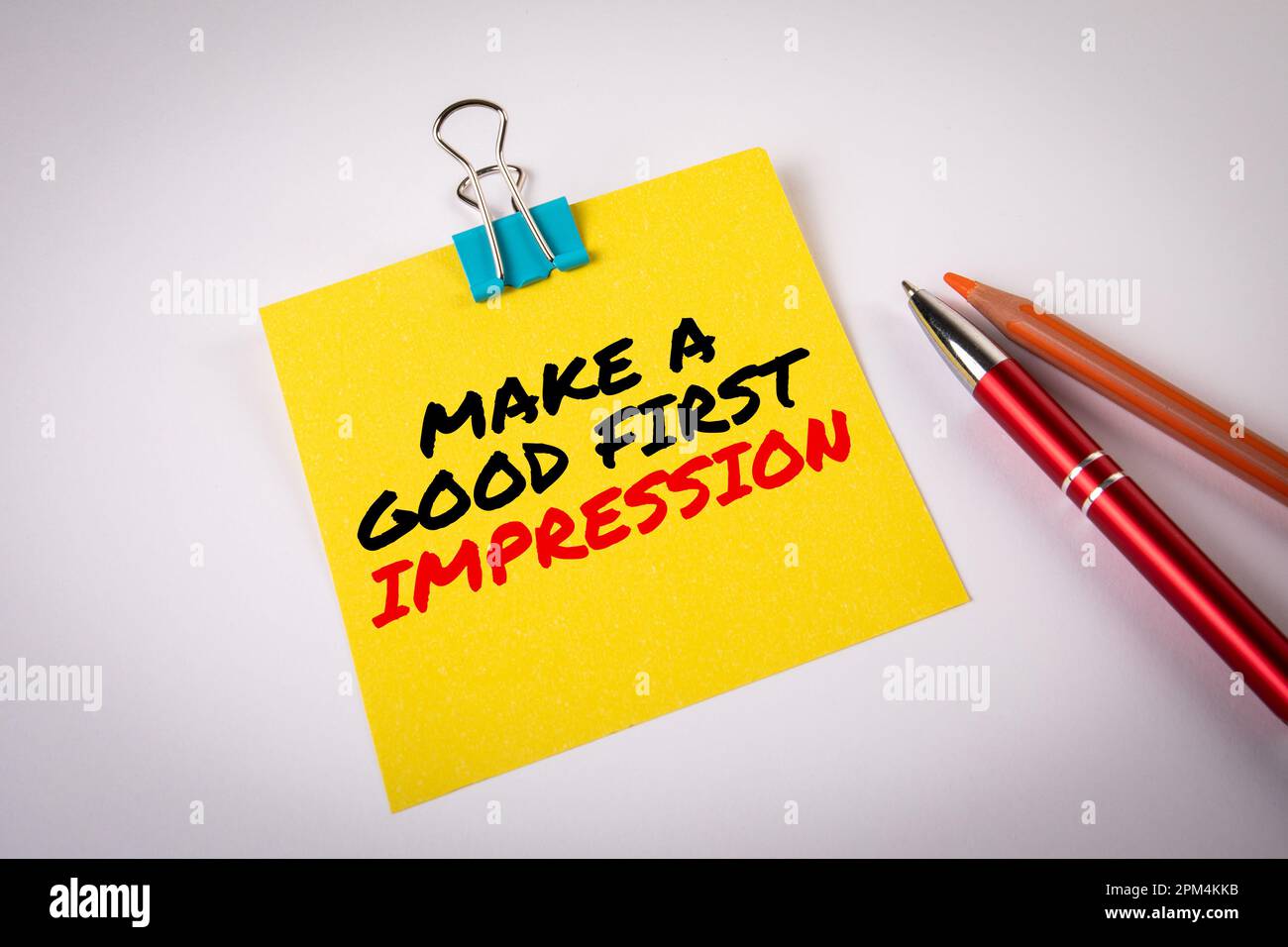 Make a Good First Impression. Notepad with text on white table Stock ...