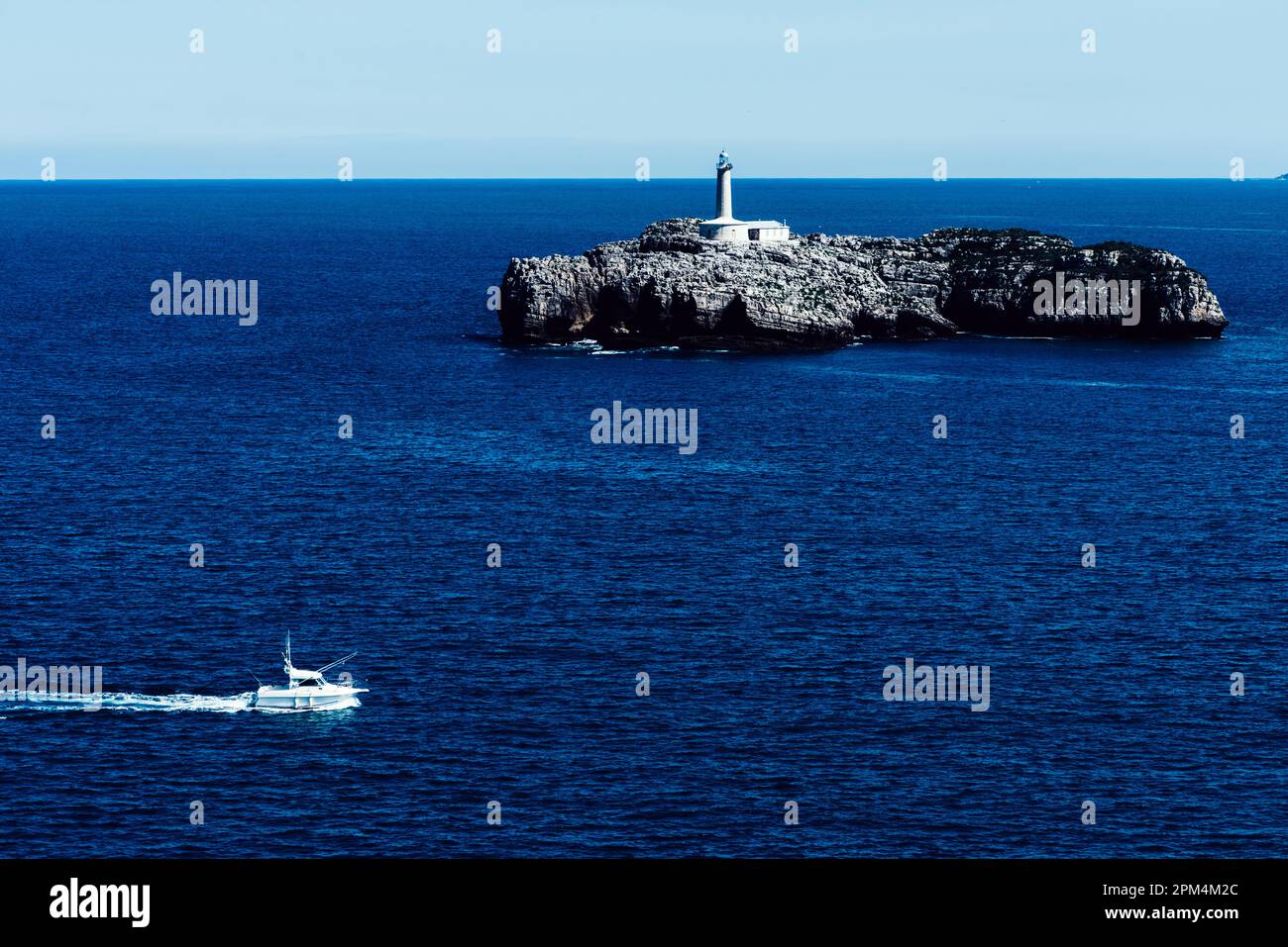 View from the Magdalena Peninsula, Santander, Spain, with a small boat ...