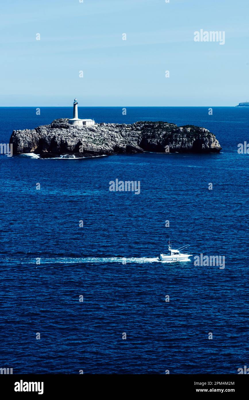 View from the Magdalena Peninsula, Santander, Spain, with a small boat ...