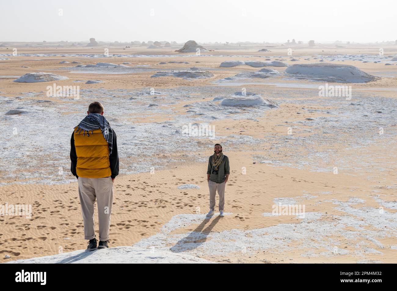 Two friends exploring the white desert in Bahariya in Egypt Stock Photo ...