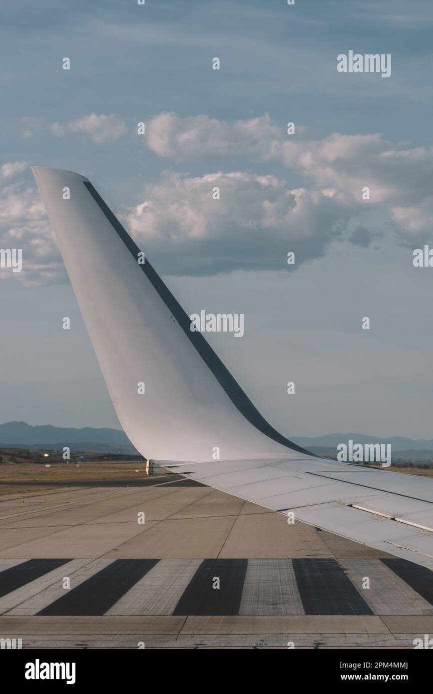 View from the porthole - Wing of an airplane taking off above the ...
