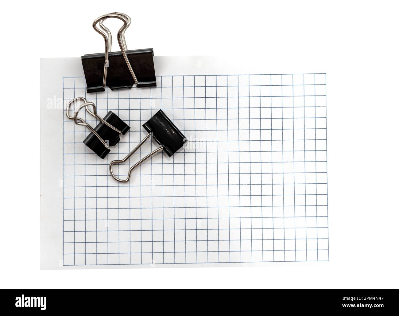 A sheet of paper in a cage for notes with a paper clip on a white ...