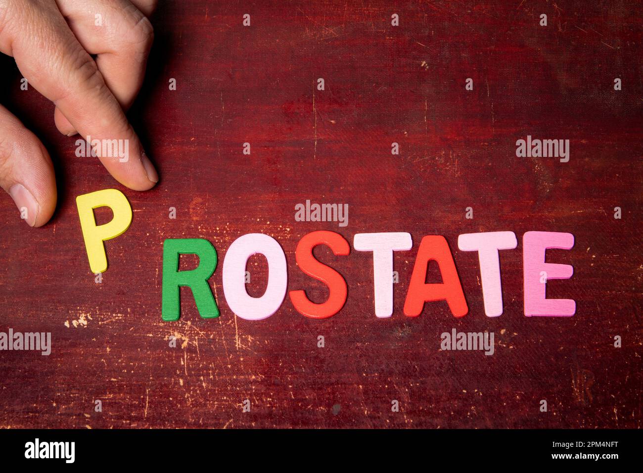 Prostate. Word from colorful alphabet letters on painted wood ...