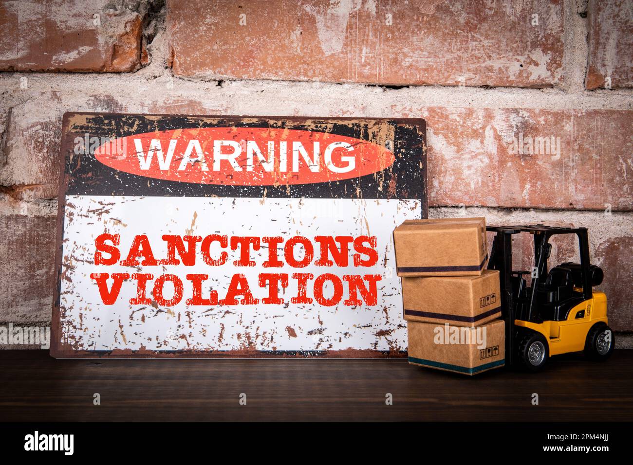 Sanctions Violation. Warning sign with text and miniature cardboard ...