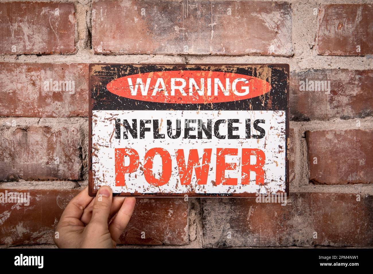 Influence is Power. Warning sign with text Stock Photo - Alamy