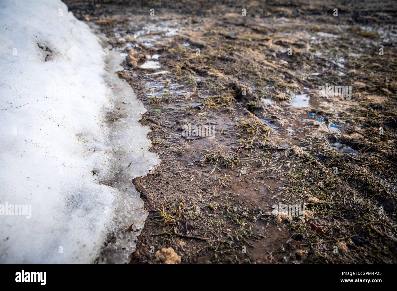 Melting snow and mud. Thaw and spring Stock Photo - Alamy