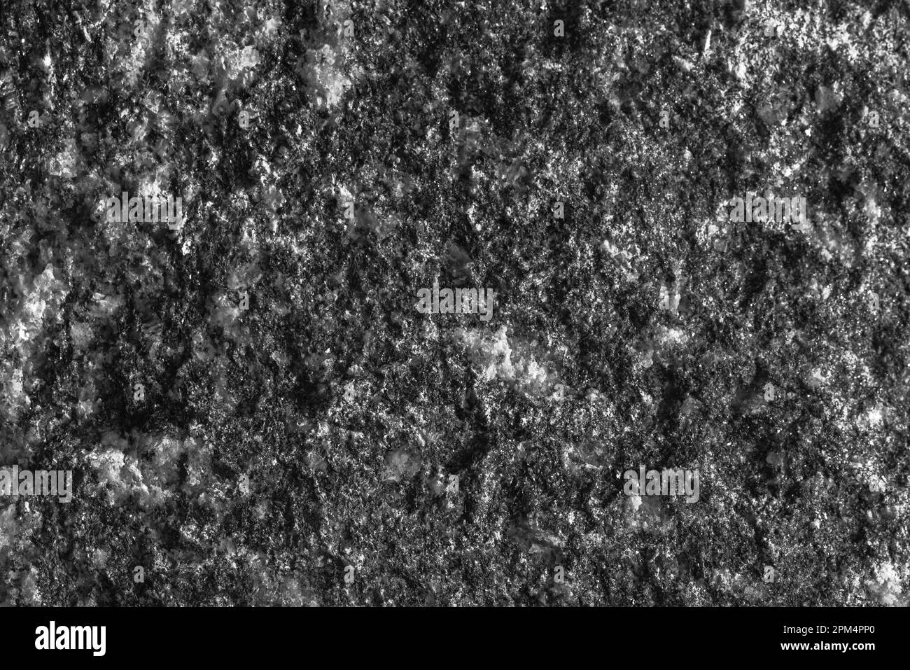 Natural black granite stone close up photo, background photo texture Stock Photo - Alamy