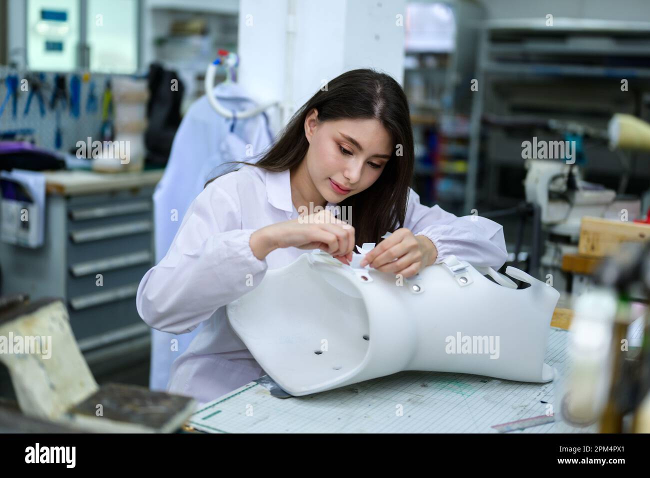 Technician of prosthetic factory fixing prosthesis in workshop Stock ...