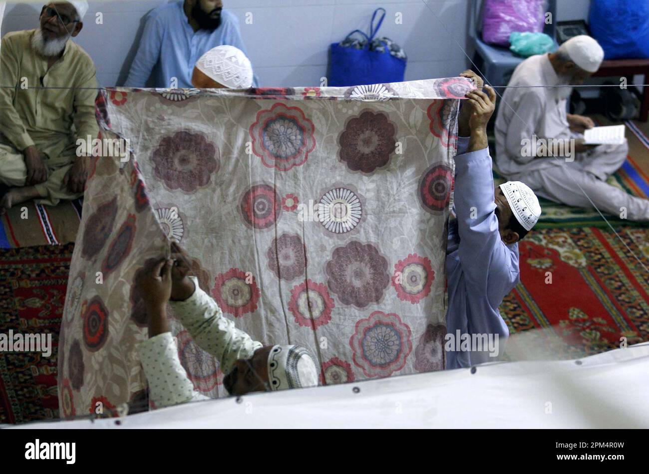 Faithful Muslims arrive for Itikaf at Thanvi Mosque located on Lines ...