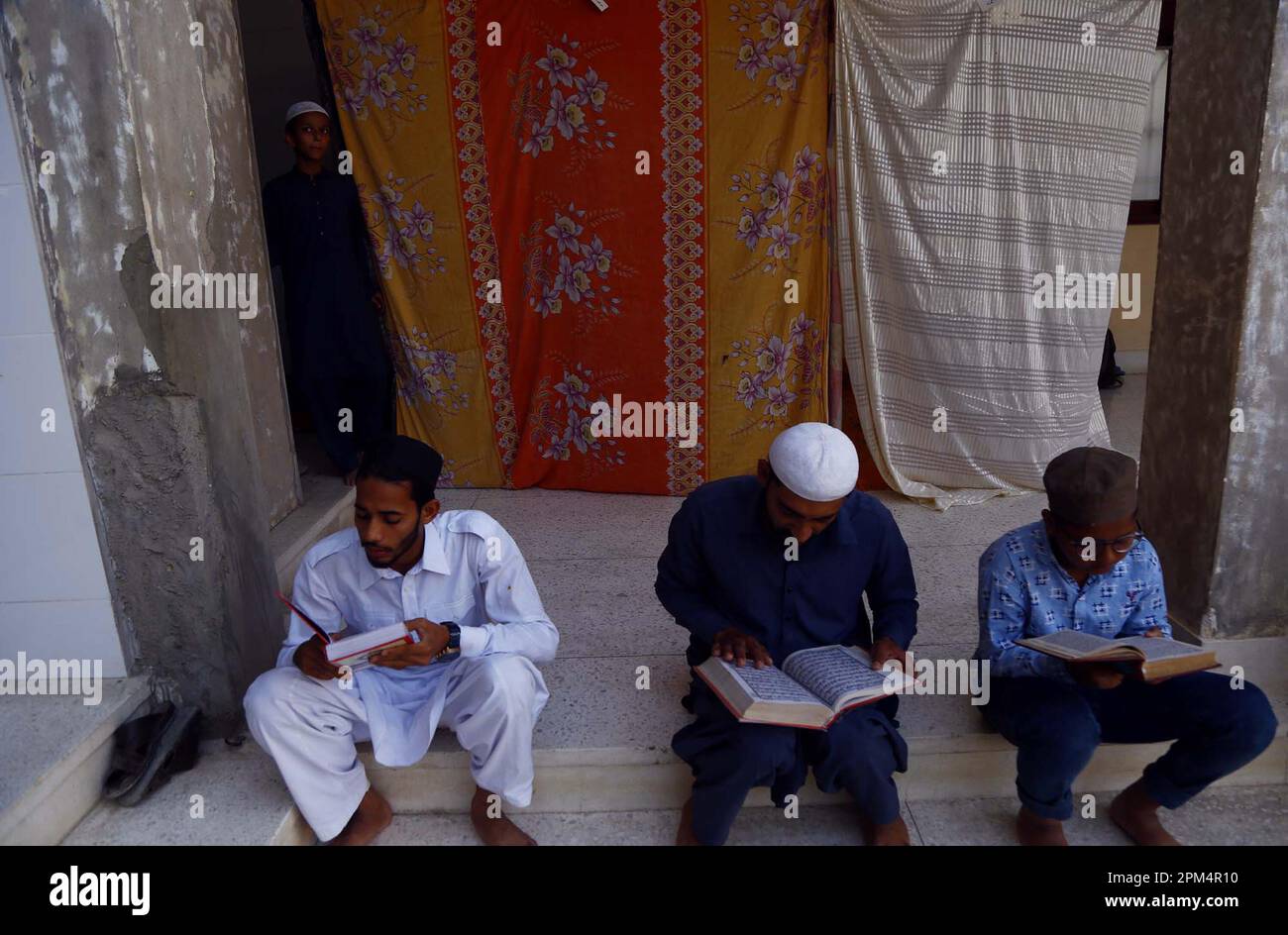 Faithful Muslims busy in prayer as they perform Itikaf worship at ...
