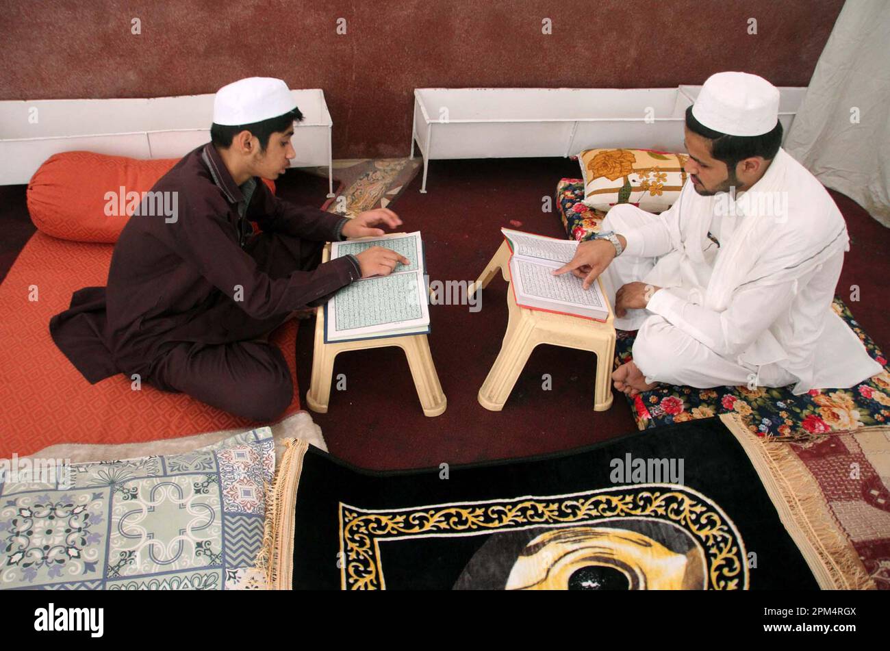 Faithful Muslims busy in prayer as they perform Itikaf worship at ...