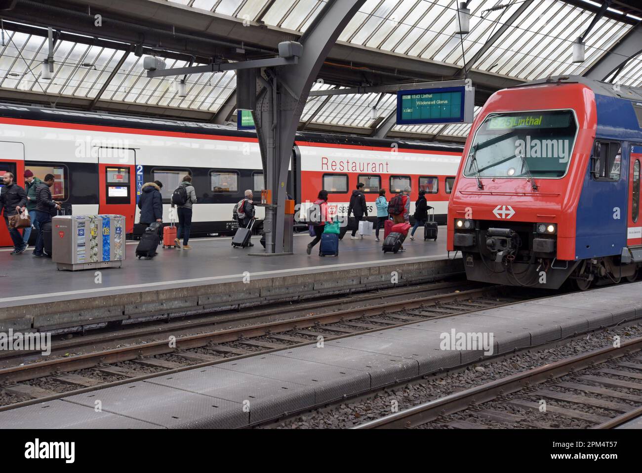 Passengers catching a Swiss Railways SBB train at Zurich Central ...