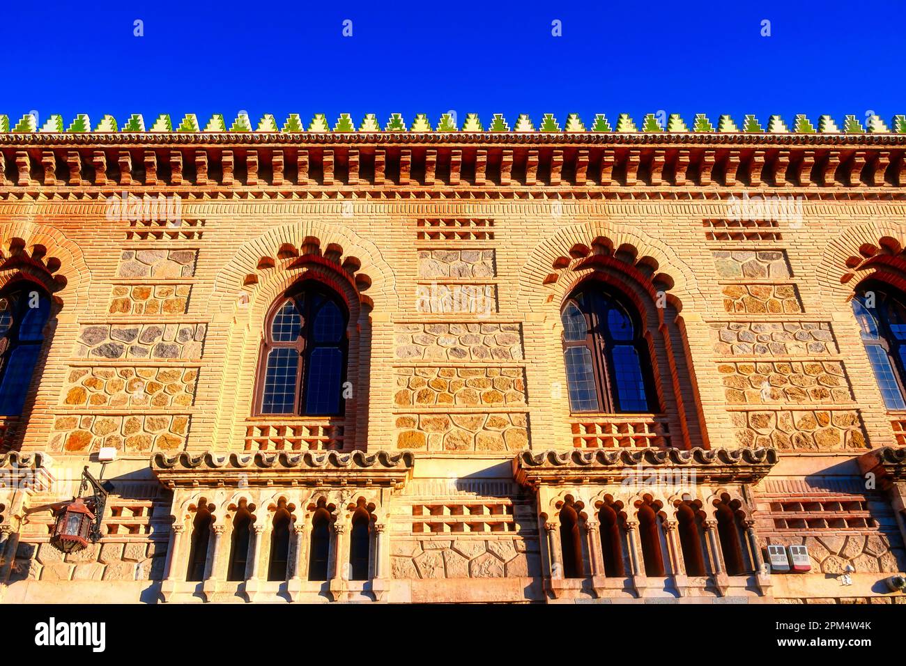 Low angle view of a brick and stone lateral wall. Antique architecture ...