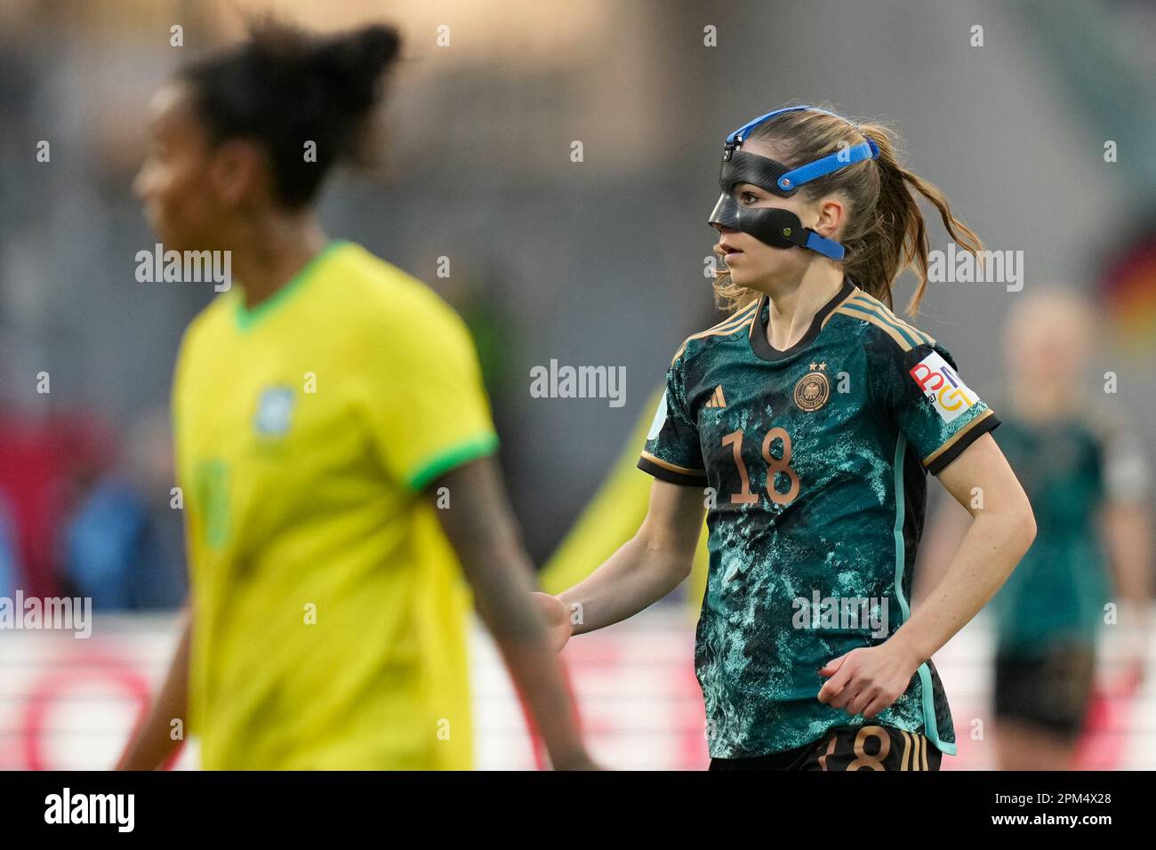 Germany's Melanie Leupolz wears a protective mask during the women's ...