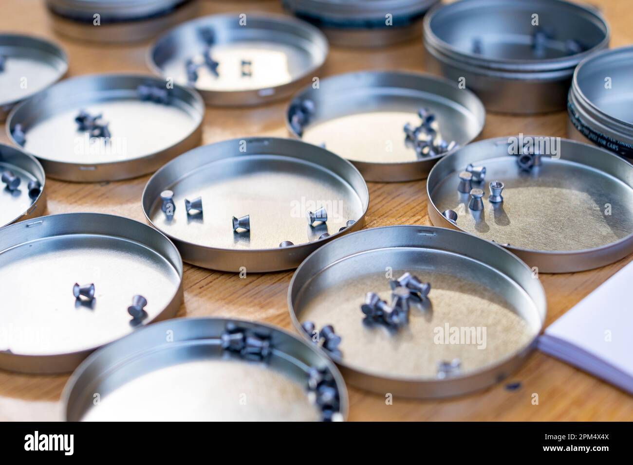 Metal air rifle ammunition in round metal boxes in a shooting ...