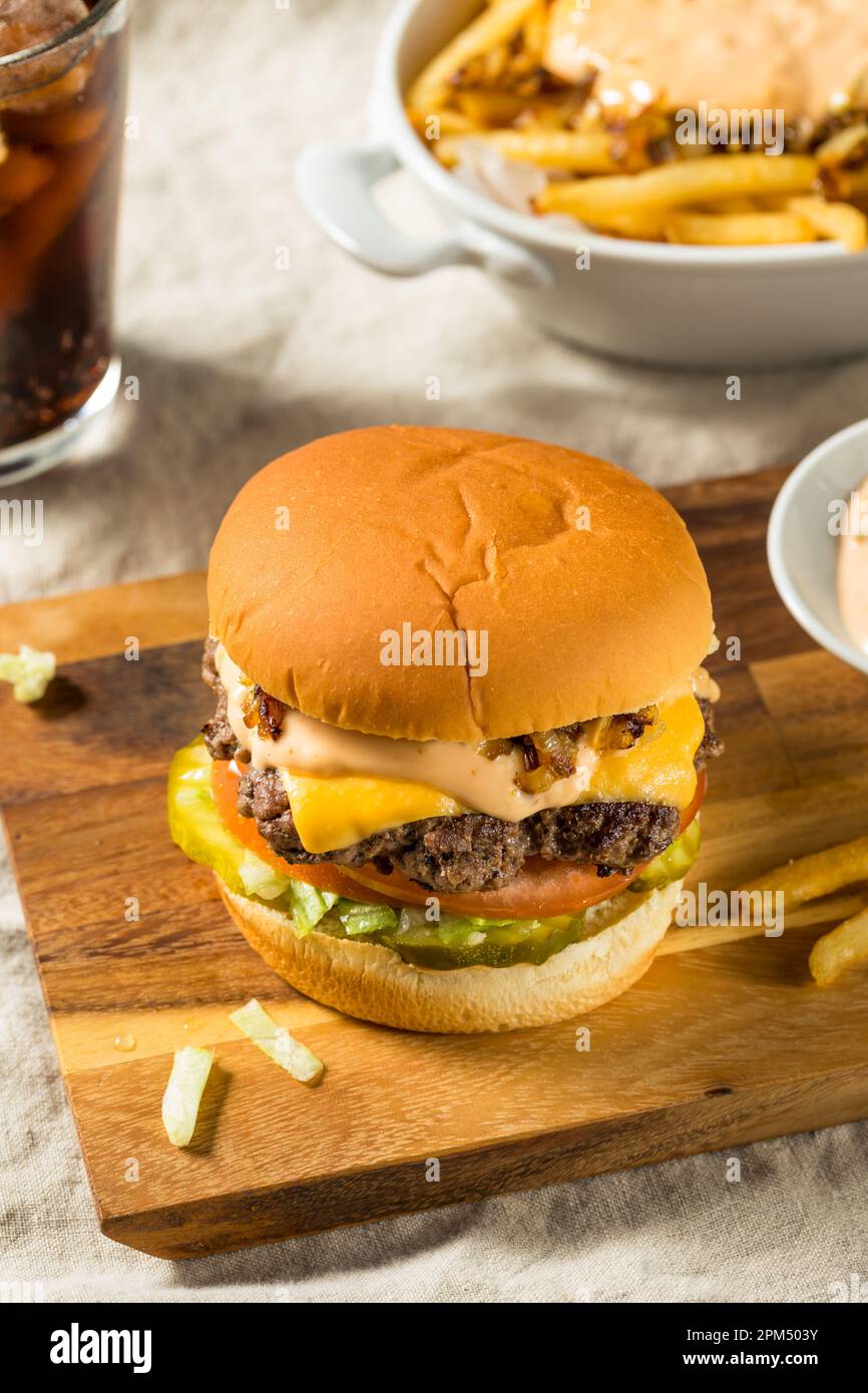 Fast Food Animal Cheeseburger with Burger Sauce and Pickles Stock Photo ...