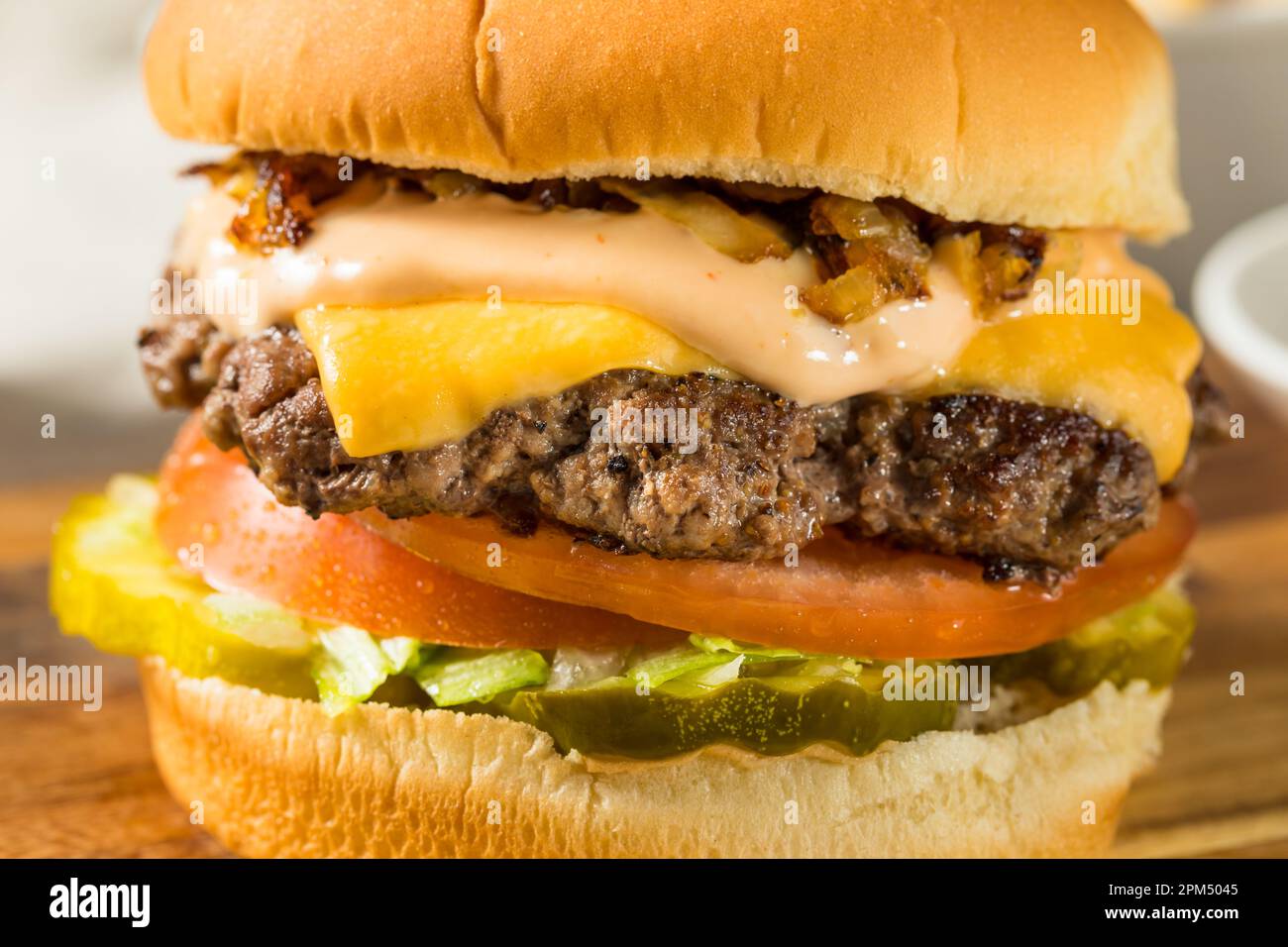 Fast Food Animal Cheeseburger with Burger Sauce and Pickles Stock Photo ...