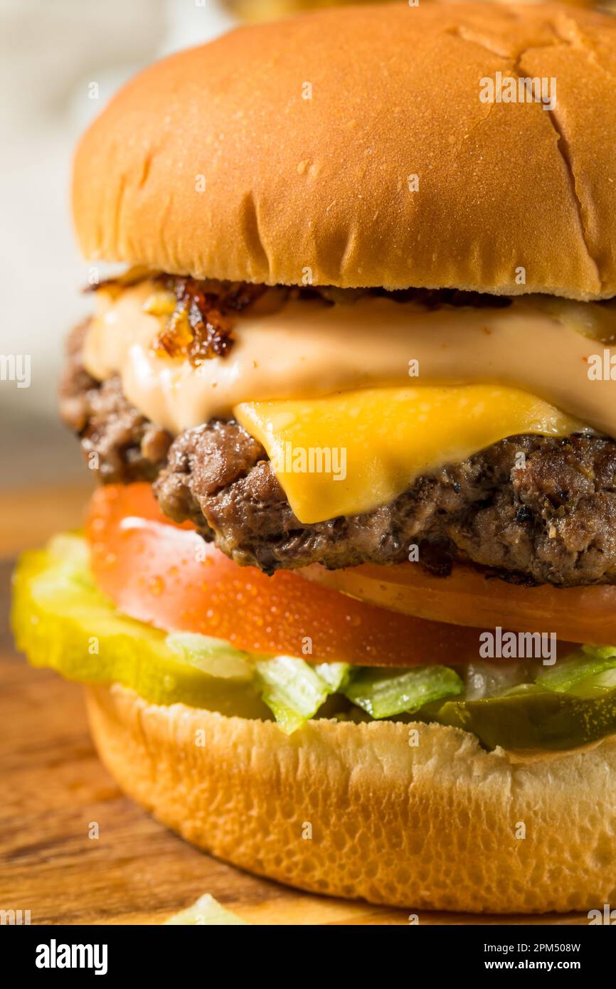 Fast Food Animal Cheeseburger with Burger Sauce and Pickles Stock Photo ...