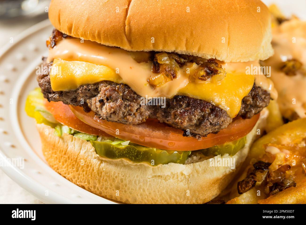 Fast Food Animal Cheeseburger with Burger Sauce and Pickles Stock Photo ...