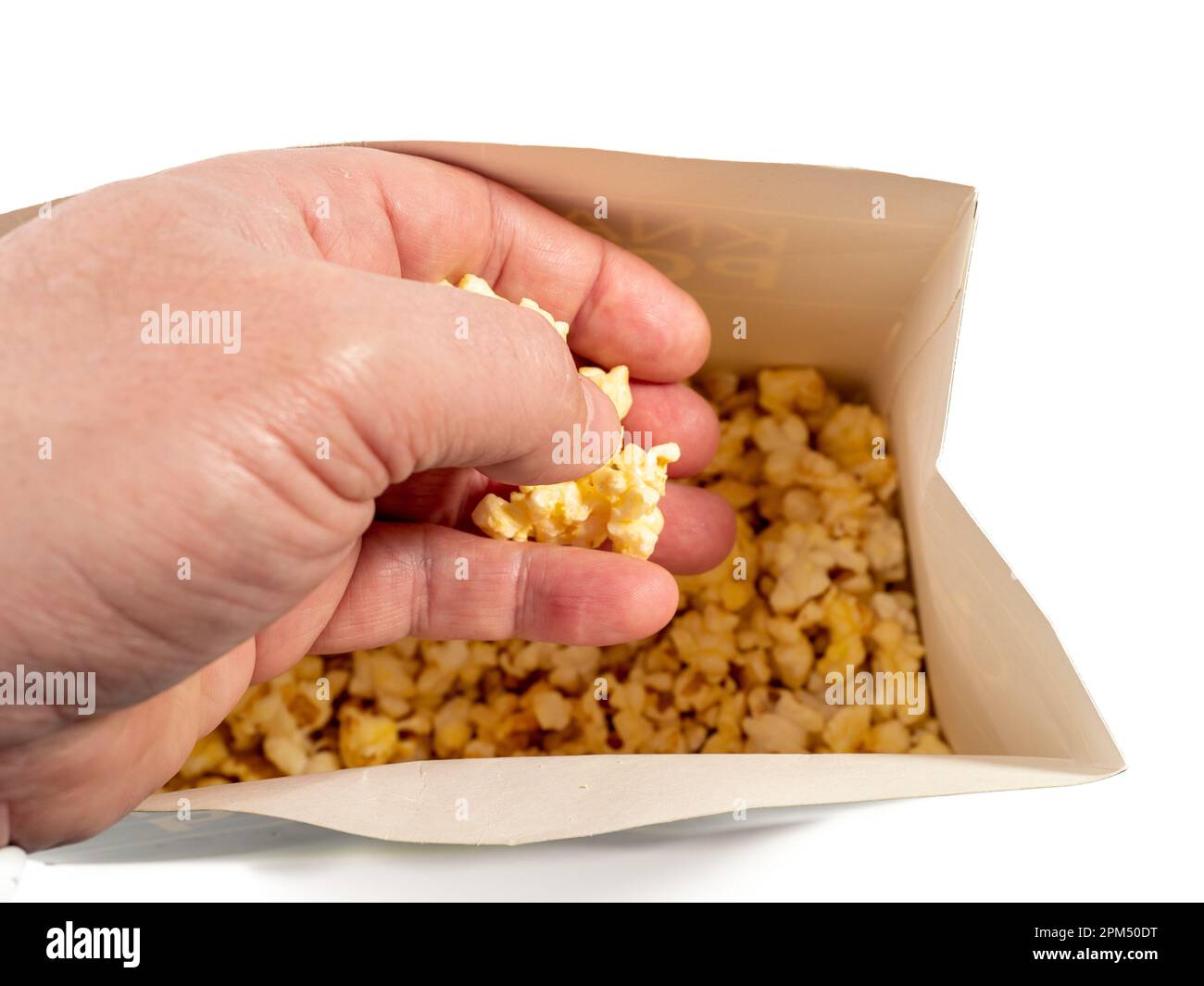 Popcorn in a cardboard box on a white background. Sweet popcorn on ...
