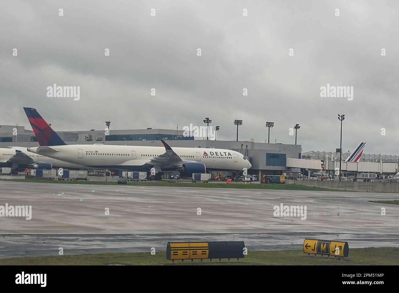A Delta Air Lines airplane sits at a gate at Hartsfield-Jackson Atlanta ...